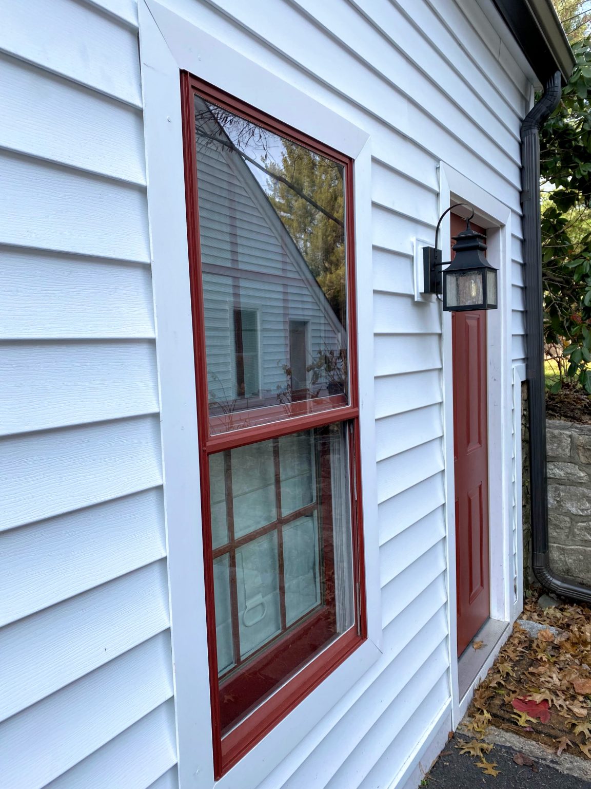 White Farmhouse with Red Windows (#1 Tip for How to Make Vinyl Siding ...